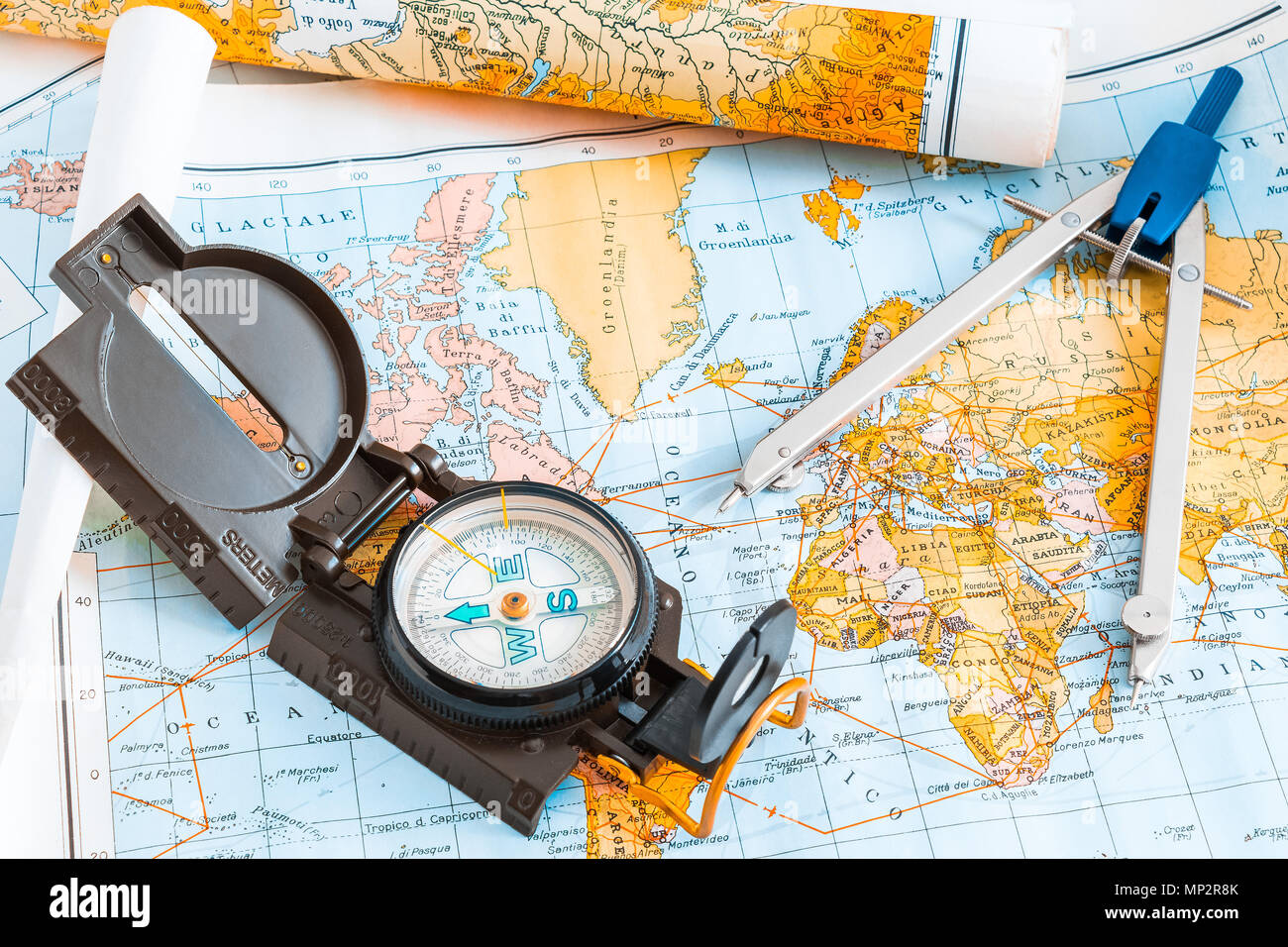 A compass on a geographical map to plan a trip Stock Photo - Alamy
