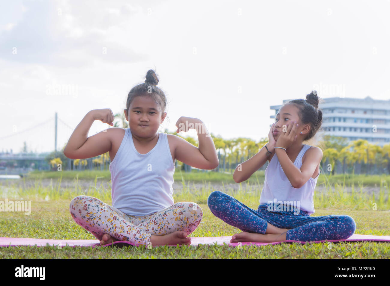 the fat girl and thin girl playing have fun in the park , child girl ...