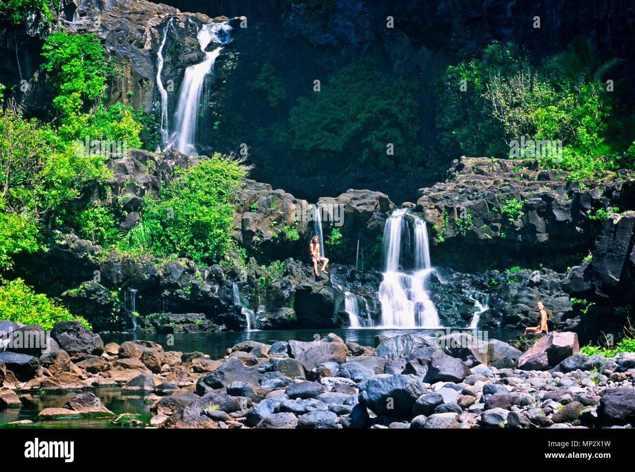 A couple cools off at the Seven Pools of Ohe'o, Maui, Hawaii Stock ...