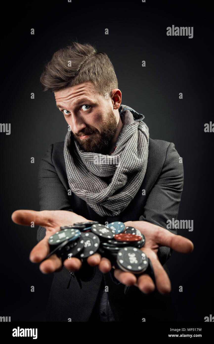 man holding poker chips Stock Photo - Alamy