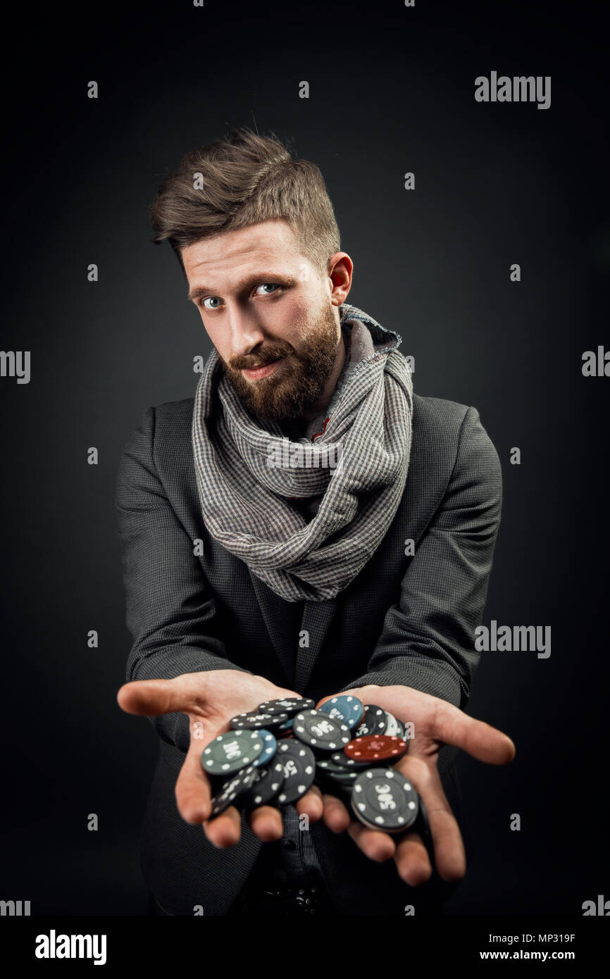 man holding poker chips Stock Photo - Alamy