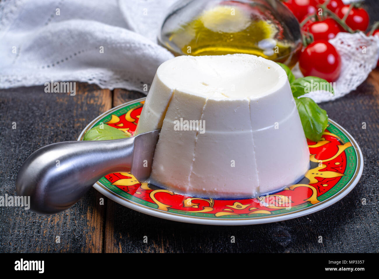 Italian soft cheese, young white ricotta cheese served with fresh basil ...