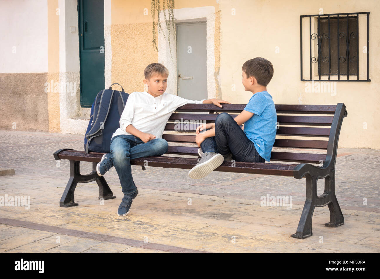 Two boys talking hi-res stock photography and images - Alamy