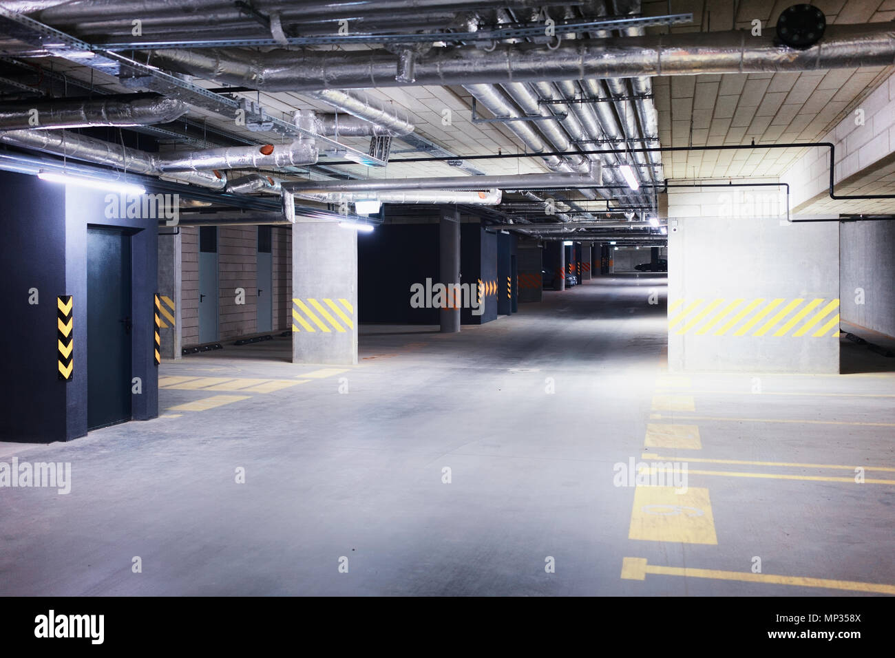 Underground car parking garage in a European modern apartment building ...