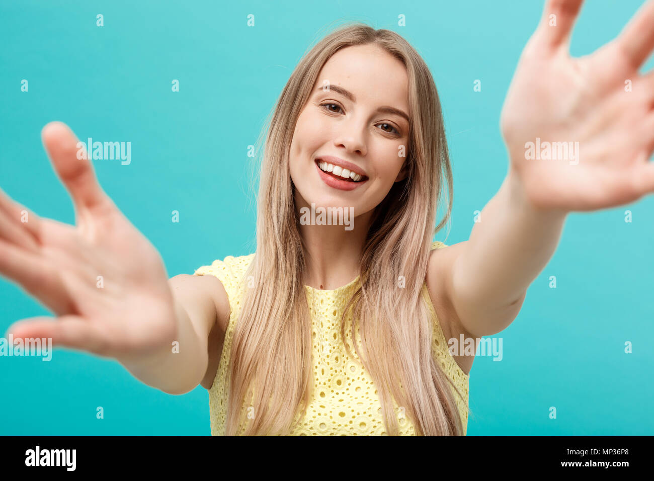Close-up portrait of attractive young woman stretching her arms, wants ...