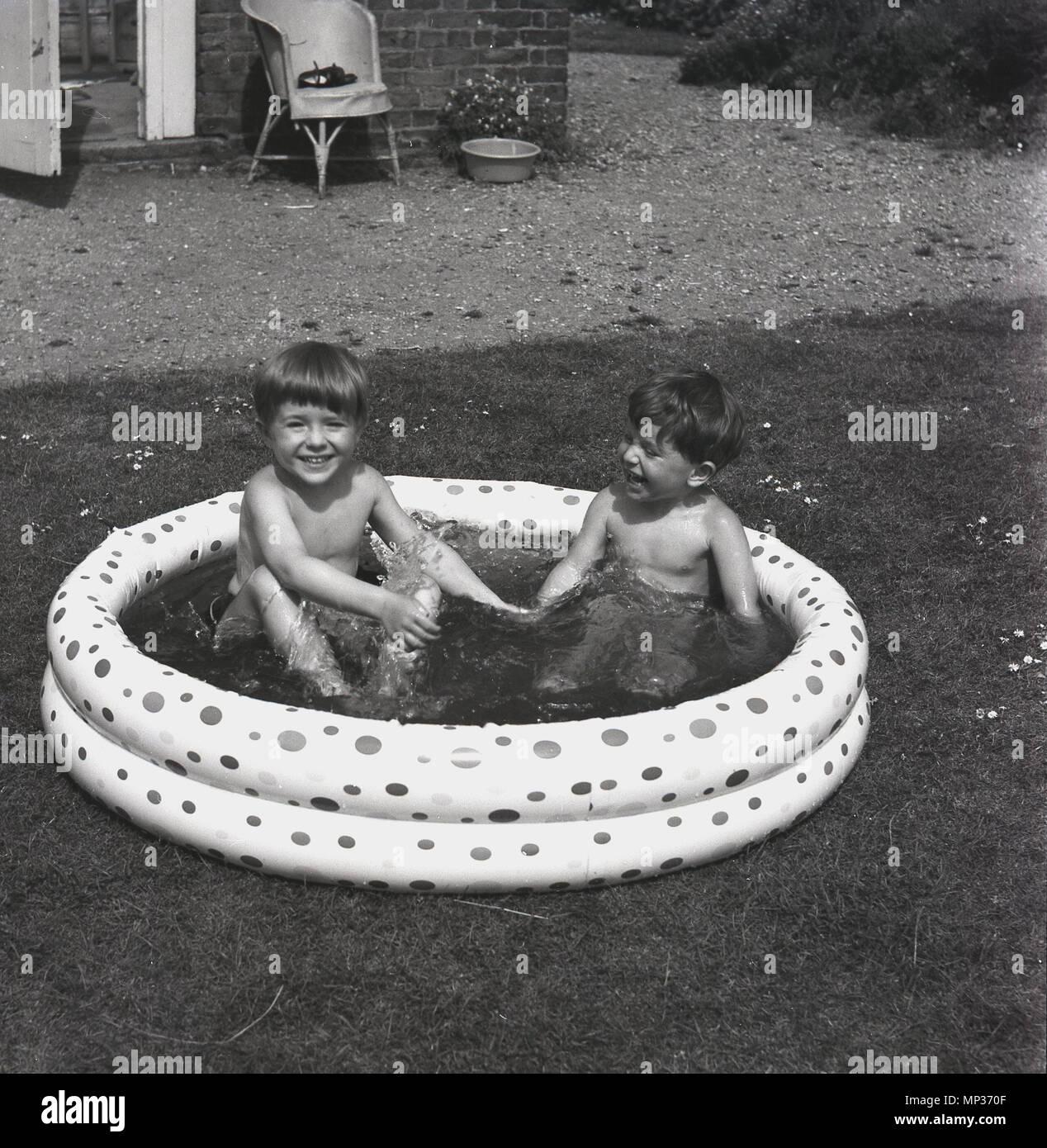 Children playing outdoor 1960s hi-res stock photography and images - Alamy
