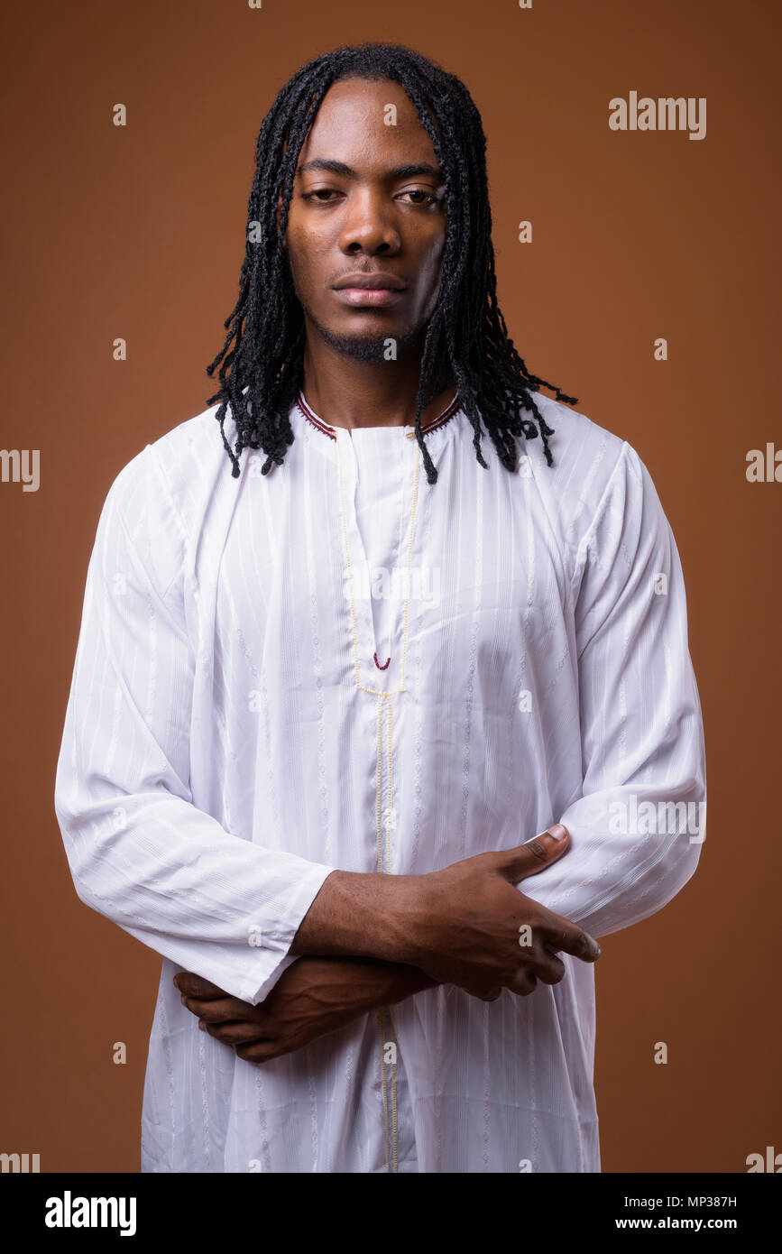 Young handsome African man wearing traditional clothes Stock Photo - Alamy