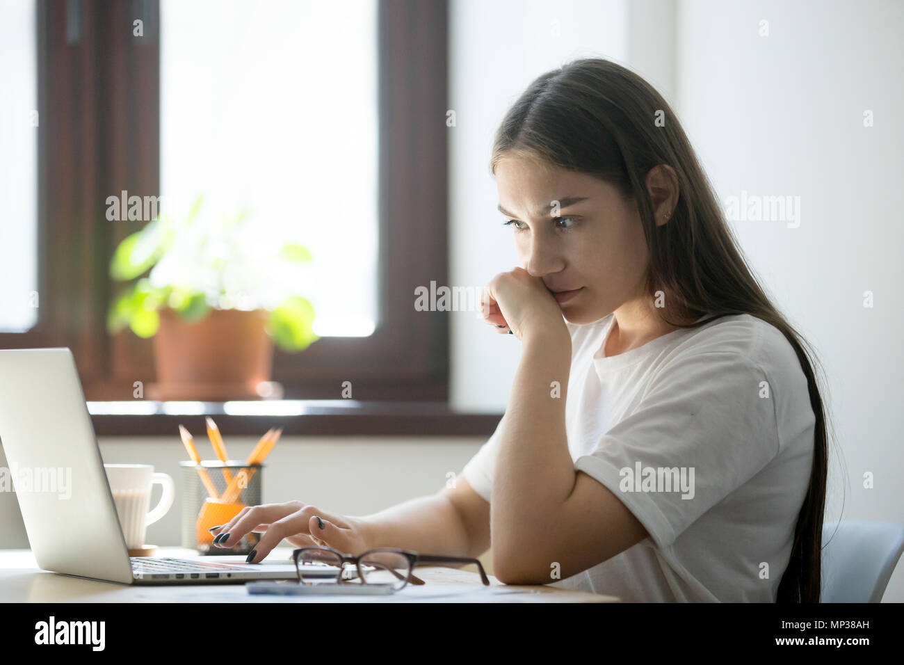 Concerned female thinking of problem solution Stock Photo - Alamy