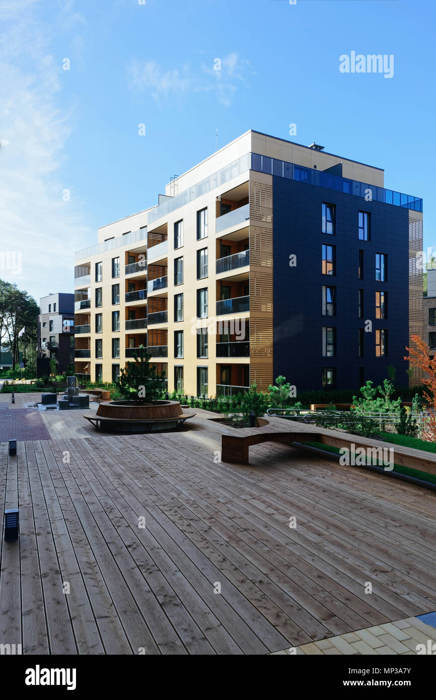 Pine tree at architectural complex of residential building. And outdoor ...