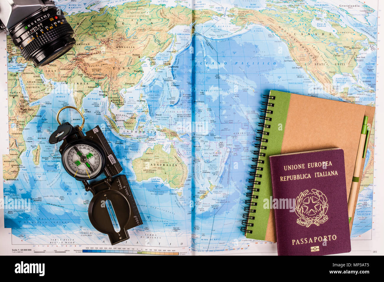 Travel planning. Compass, passport, photo camera and block notes on map ...