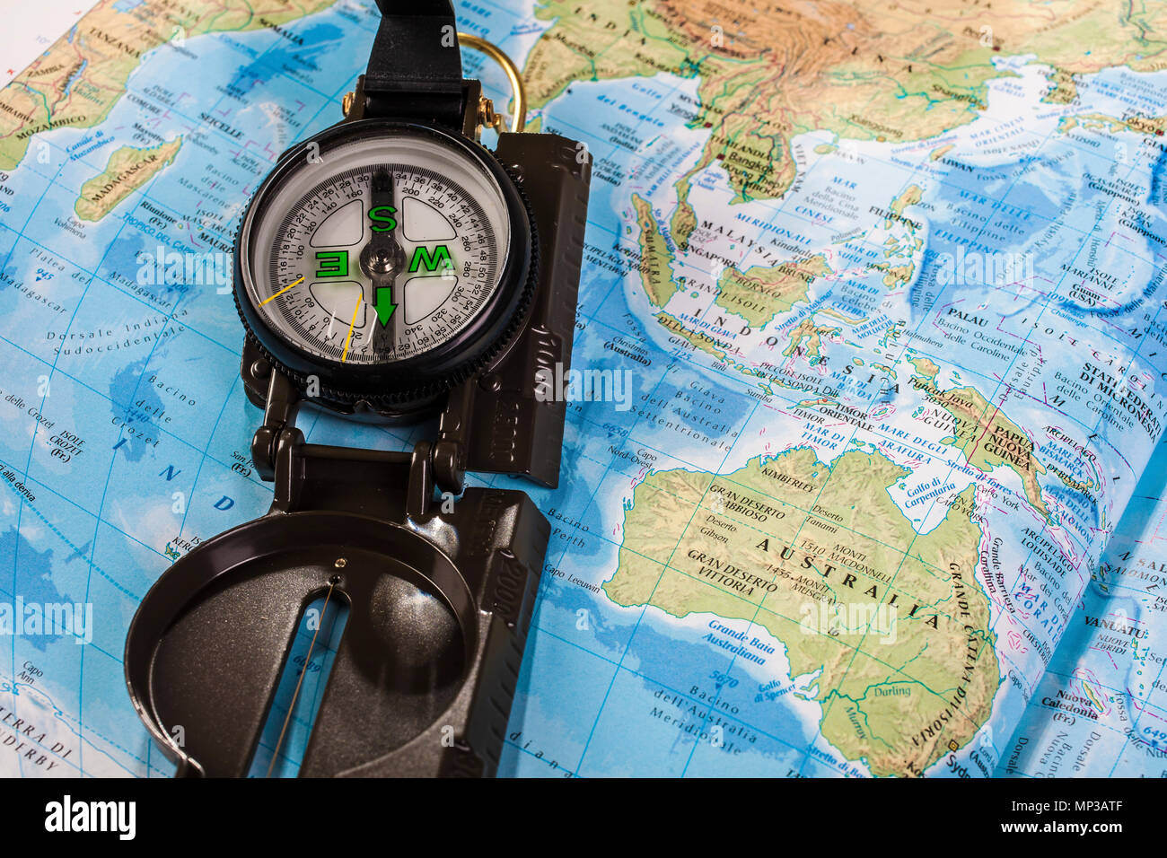Travel planning. Close up of compass on map Stock Photo - Alamy