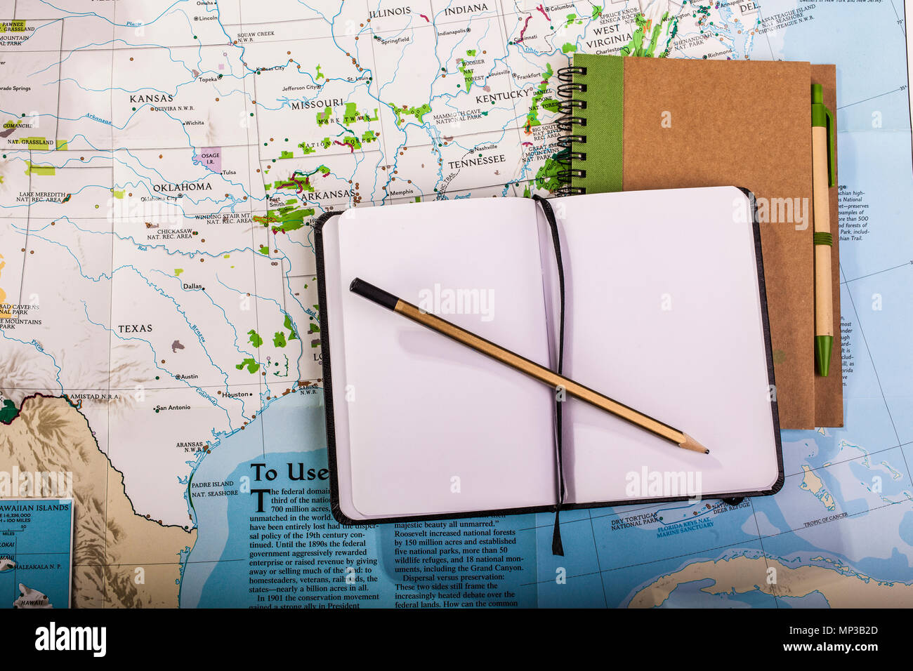 Travel planning. Top view of open block notes on map Stock Photo - Alamy