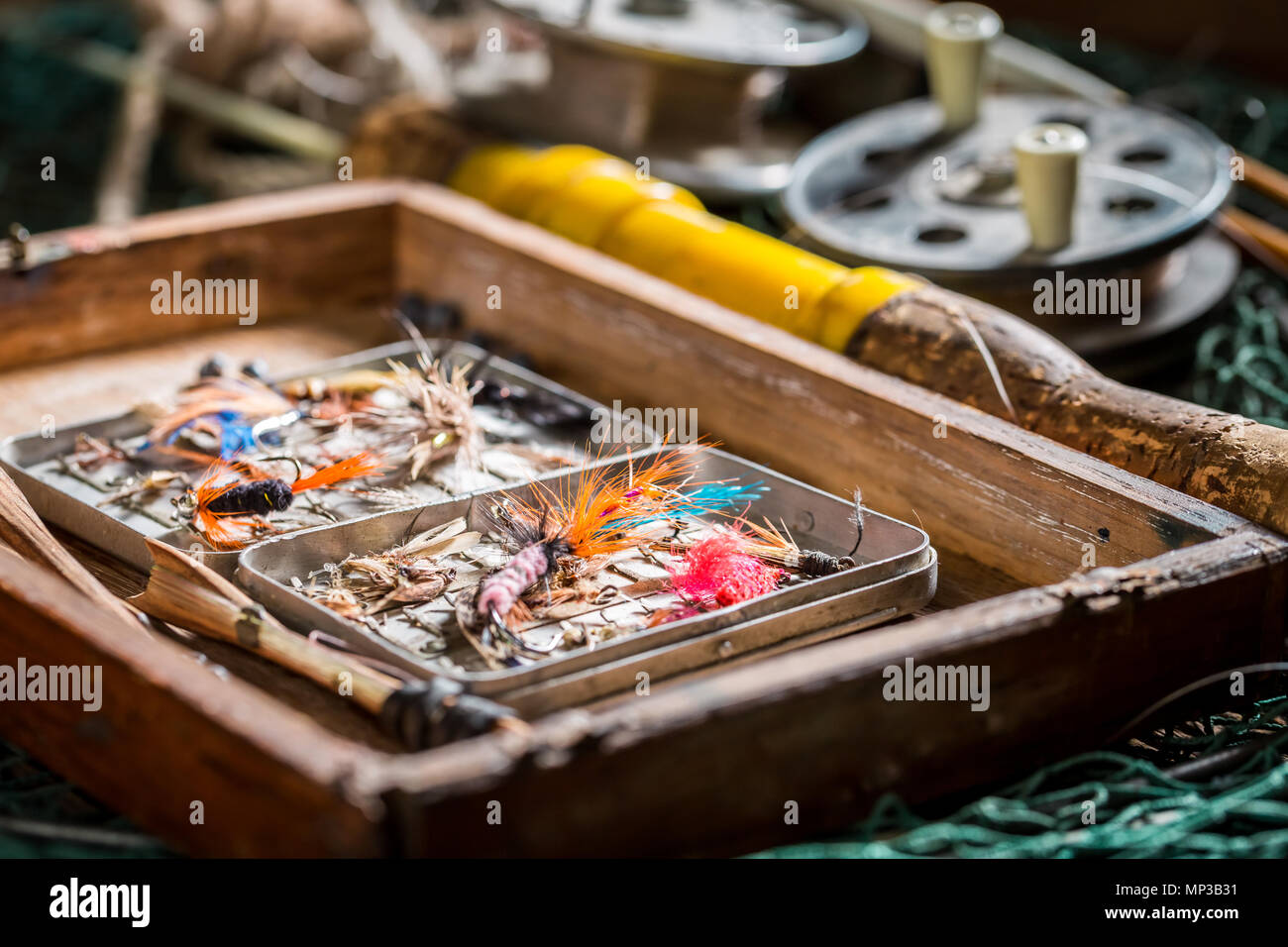 Closeup of fishing tackle with fishing flies and hooks Stock Photo - Alamy