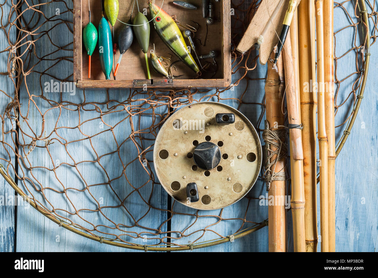 Retro fishing for equipment with net, rods and flies Stock Photo - Alamy