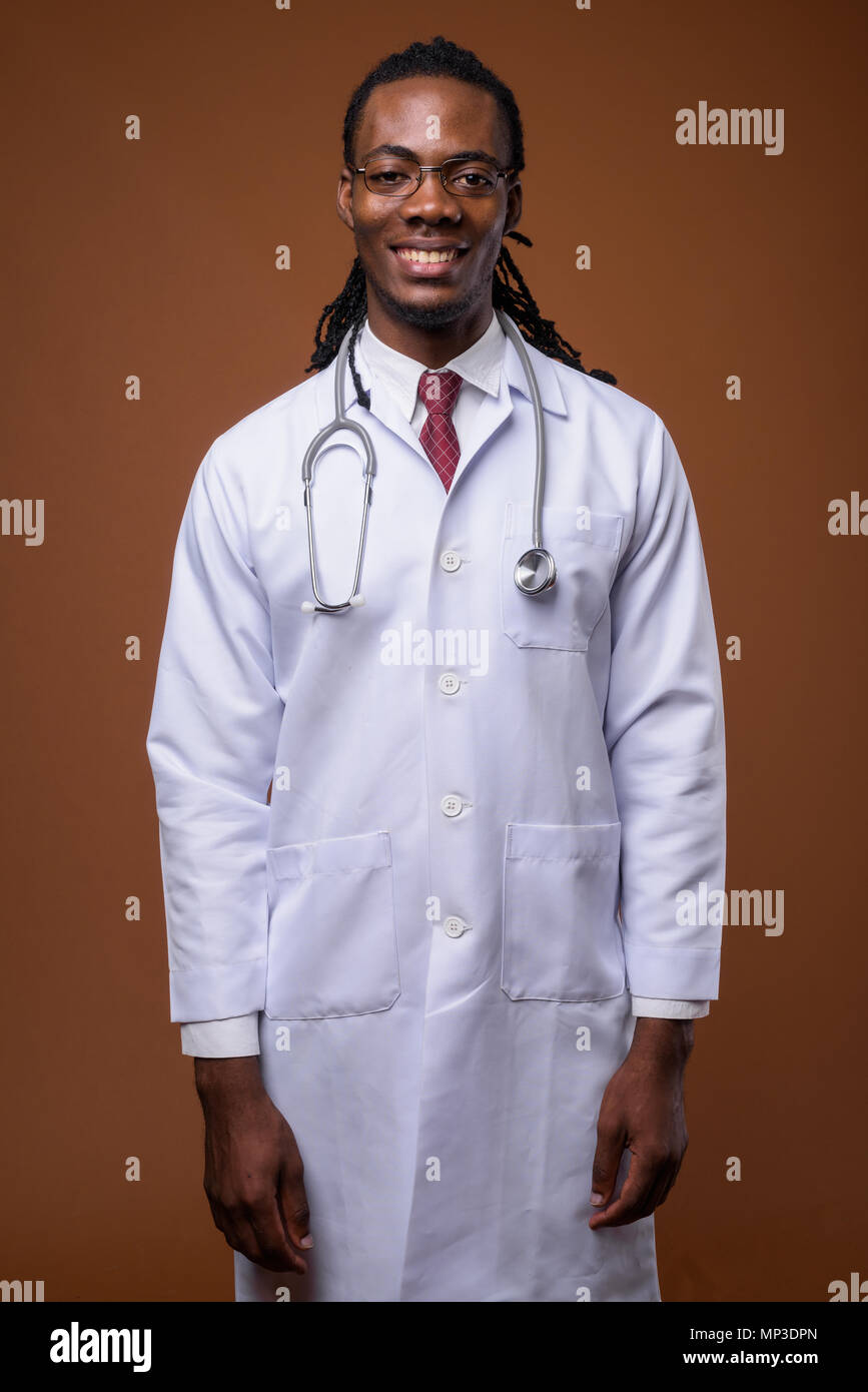 Happy african young doctor hi-res stock photography and images - Alamy