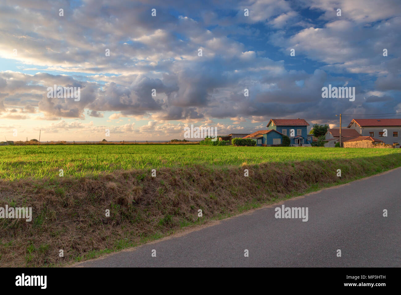 The village at sunset in Spain, Galicia. Beautiful clouds and a view of ...