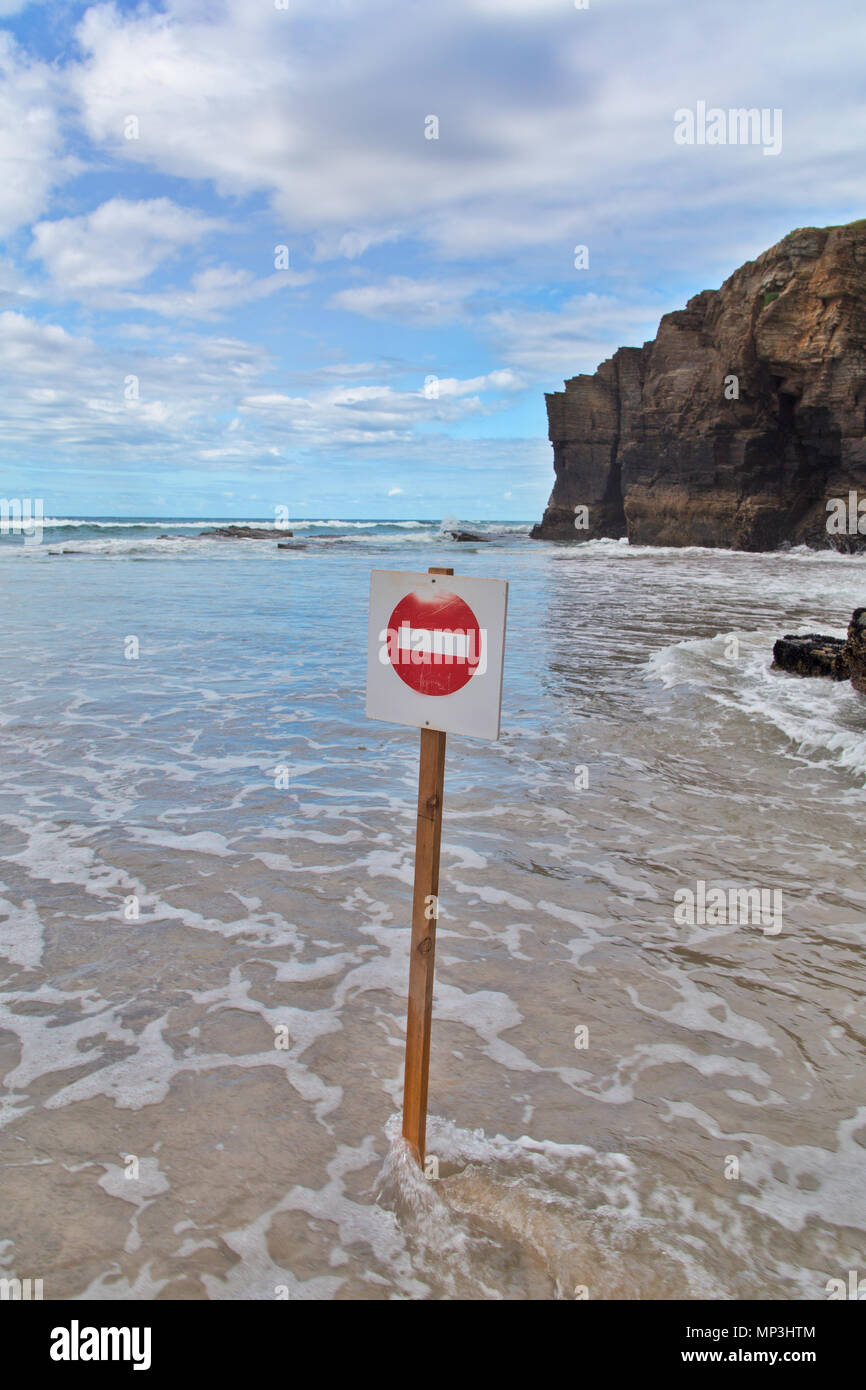 The prohibition sign on the beach. The sign forbids pass to a dangerous ...