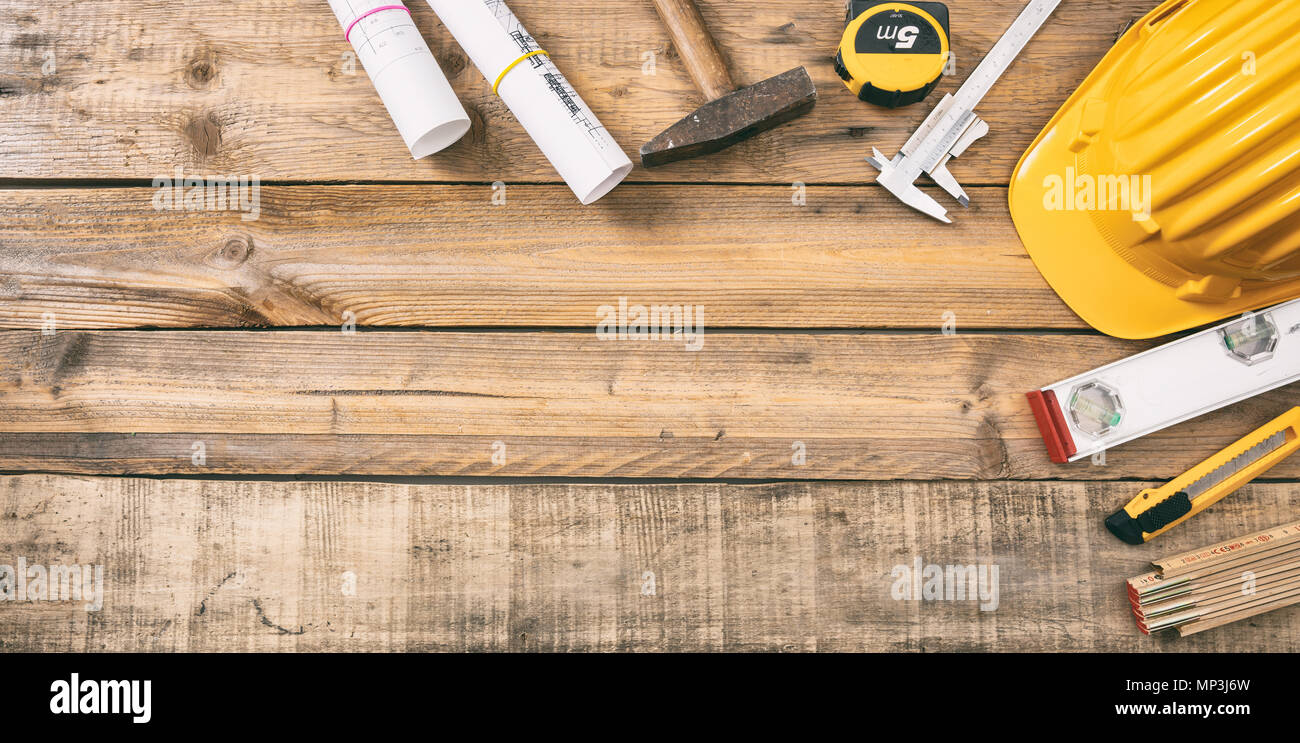 Project construction site. Hand tools, blueprints and engineering ...