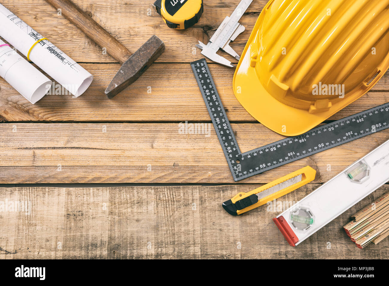 Project construction site. Hand tools, blueprints and engineering ...