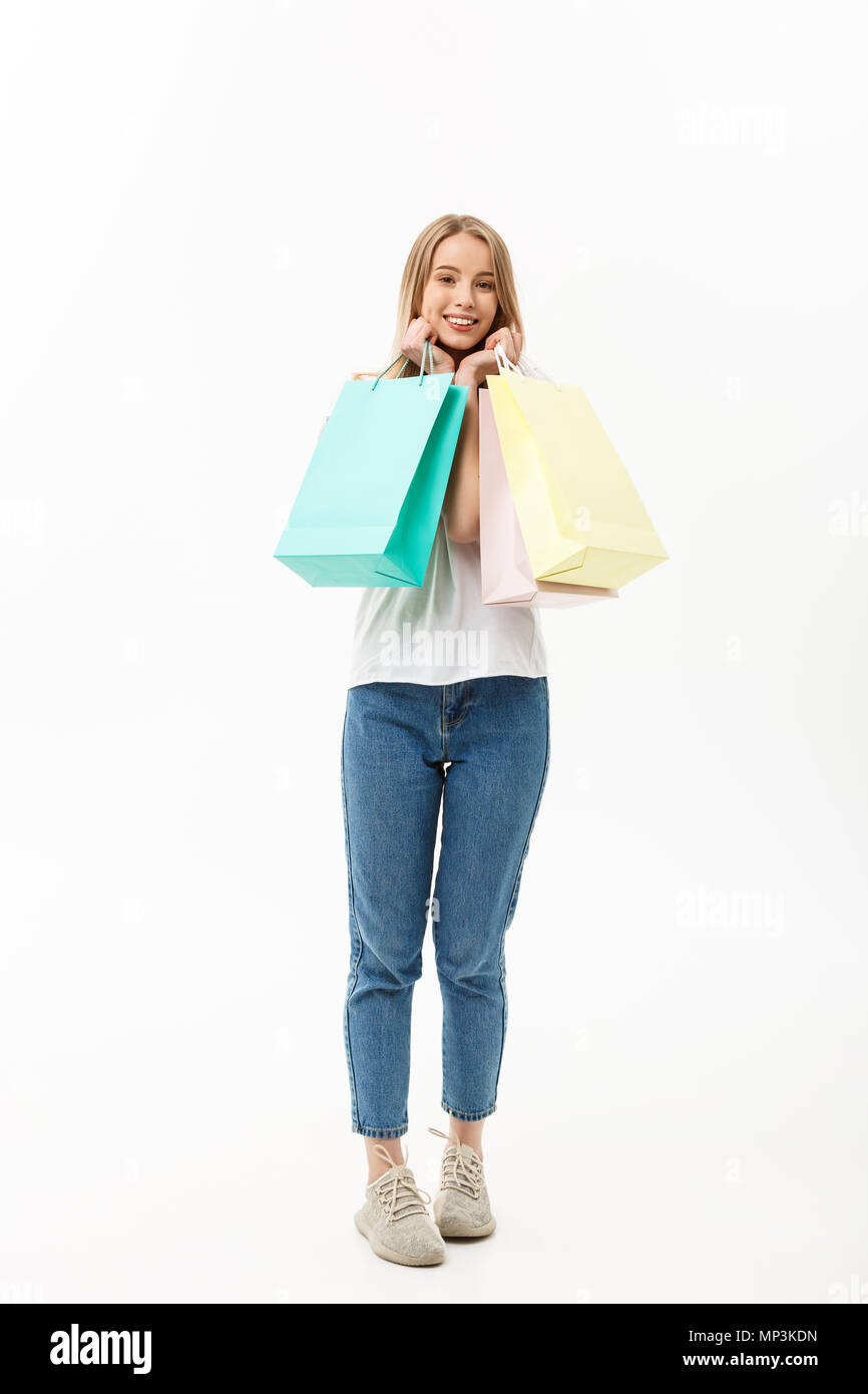 Full length of Shopper woman holding shopping bags standing happy ...