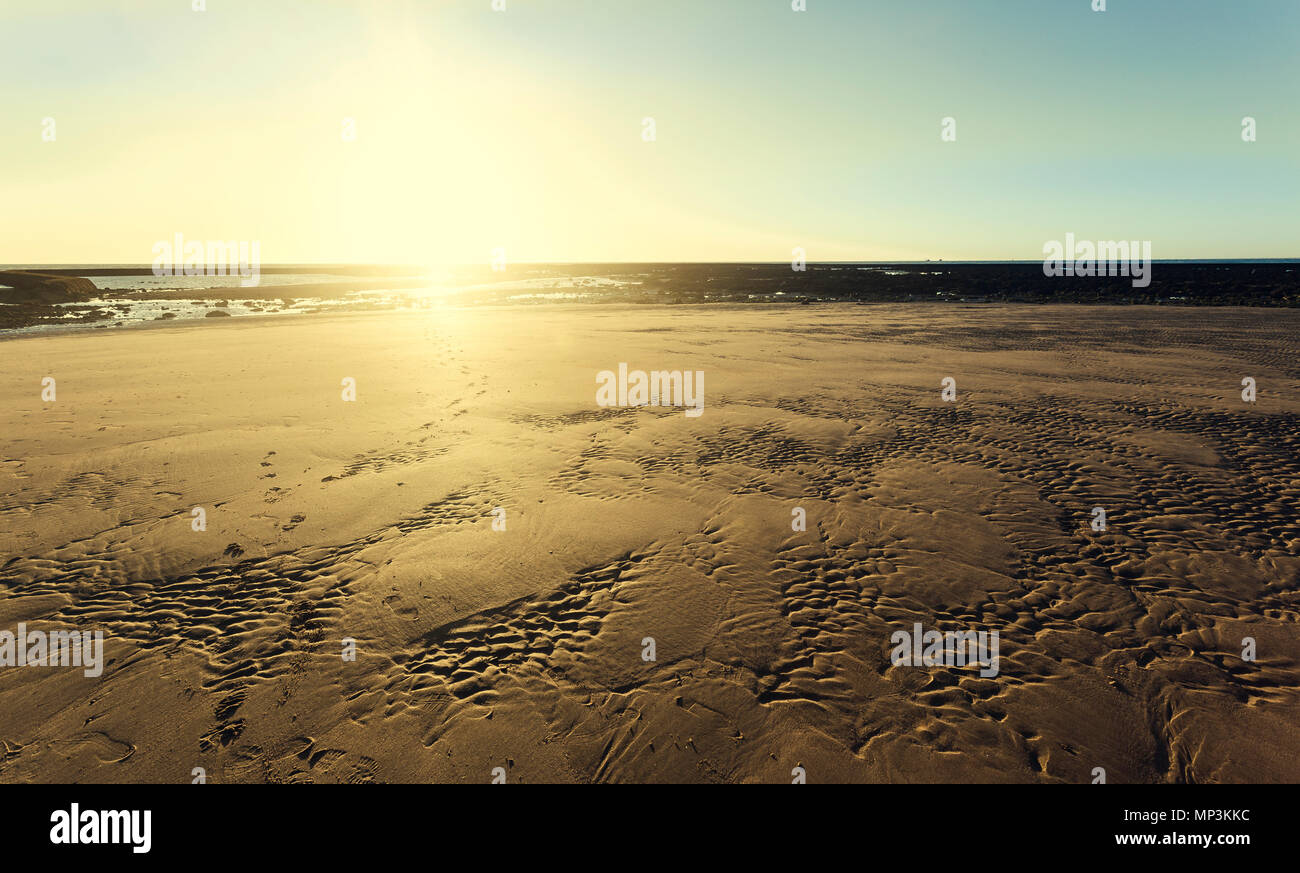 Footprints sand beach sunset hi-res stock photography and images - Alamy