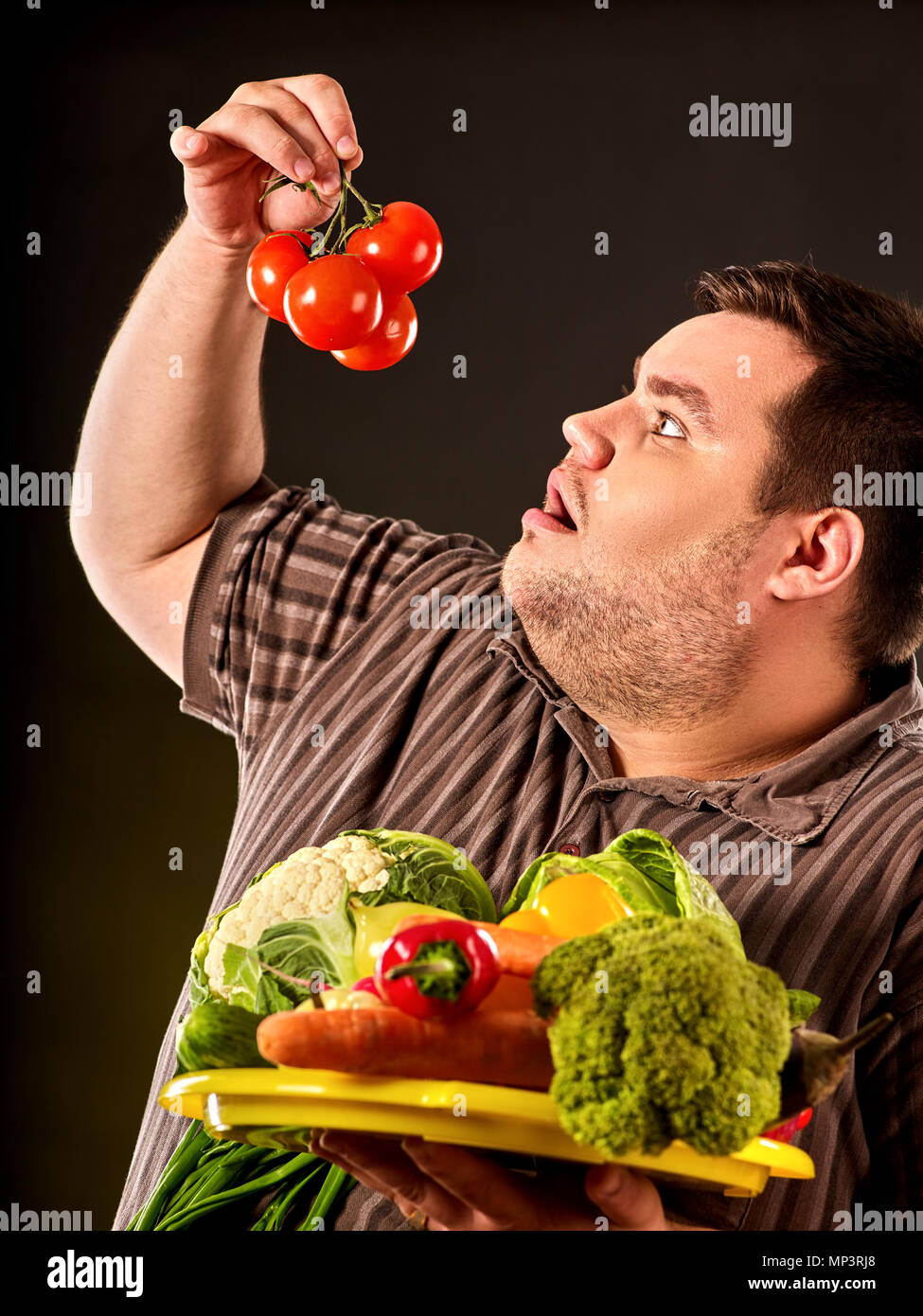 Diet fat man eating healthy food. Healthy breakfast with vegetables ...