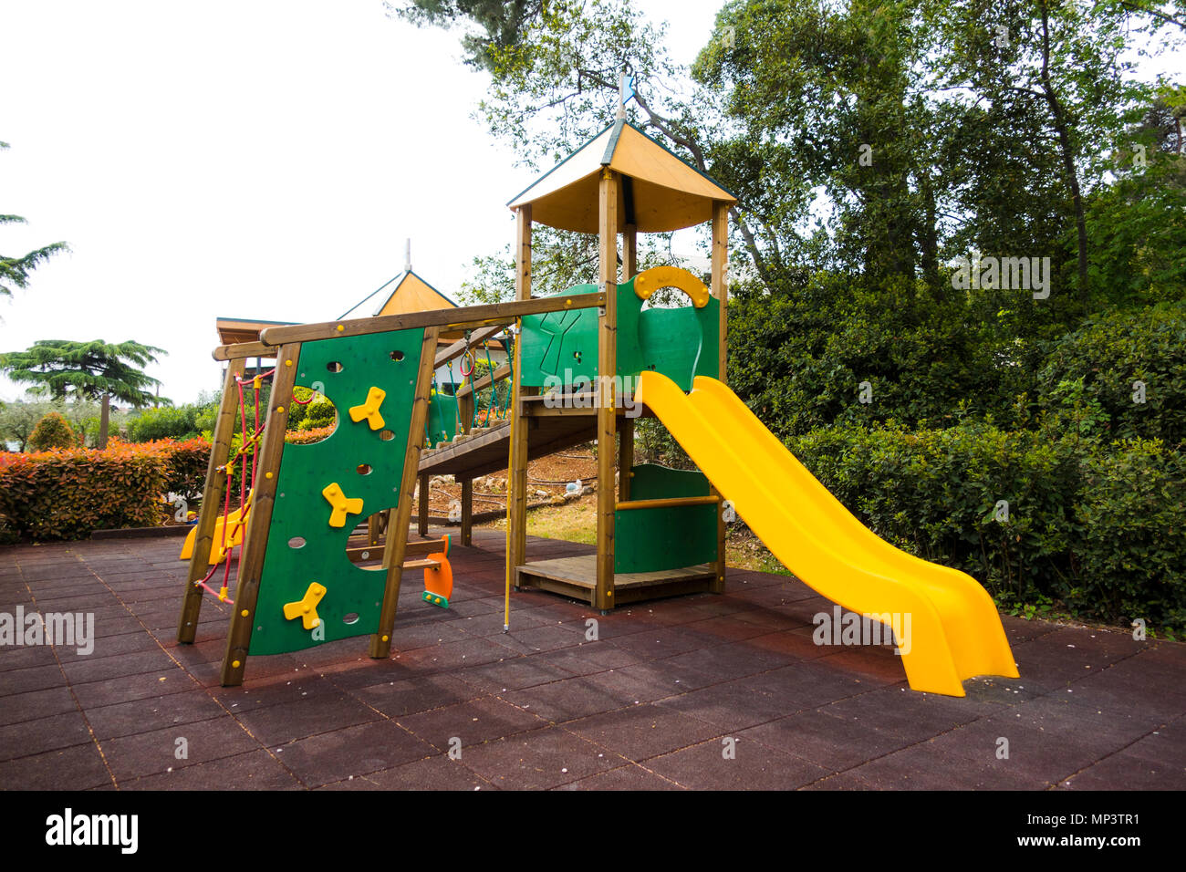 Colorful kids, childrens playground in a park Stock Photo - Alamy