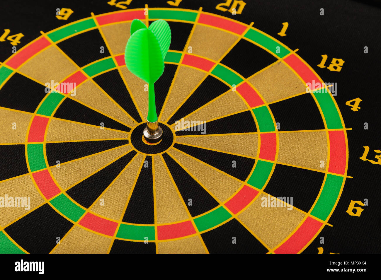 The game of darts, darts on the target Stock Photo - Alamy