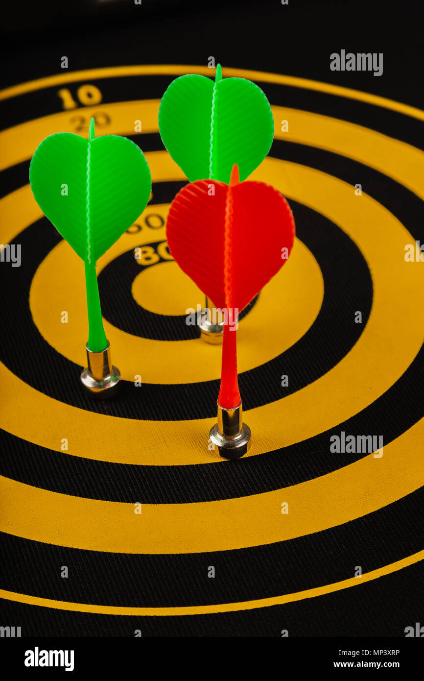 The game of darts, darts on the target Stock Photo - Alamy