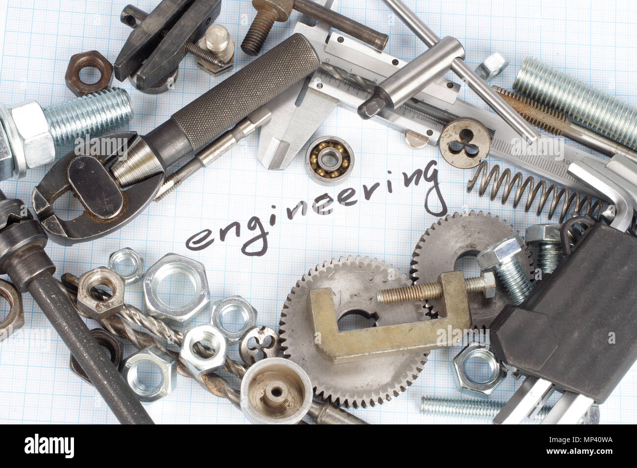 "engineering" - repair parts on graph paper background Stock Photo - Alamy