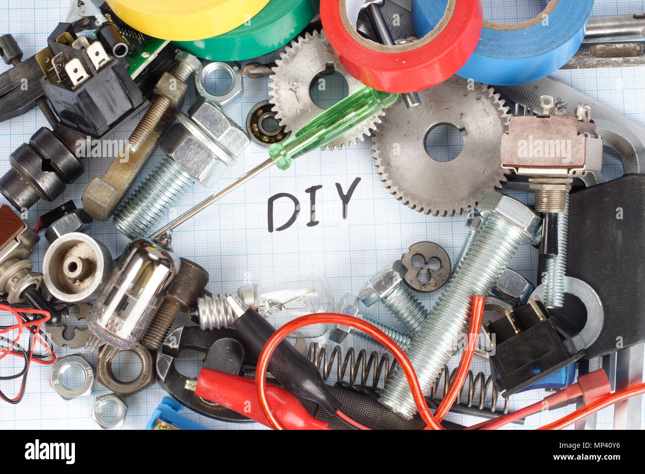 "Do it yourself" - repair parts on graph paper background Stock Photo ...