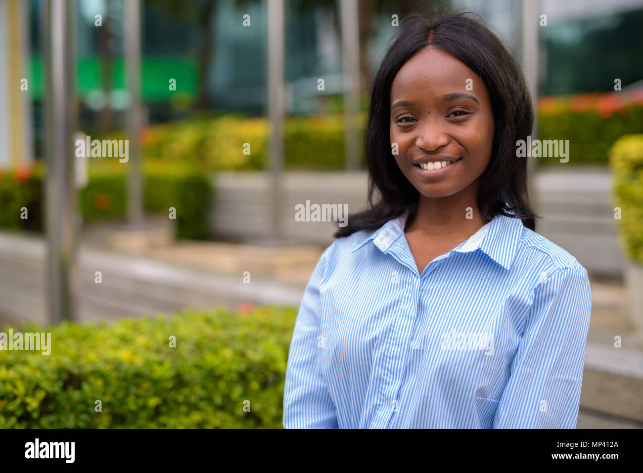 Young beautiful African Zulu businesswoman relaxing outside the Stock ... Young beautiful African Zulu businesswoman relaxing outside the Stock ...