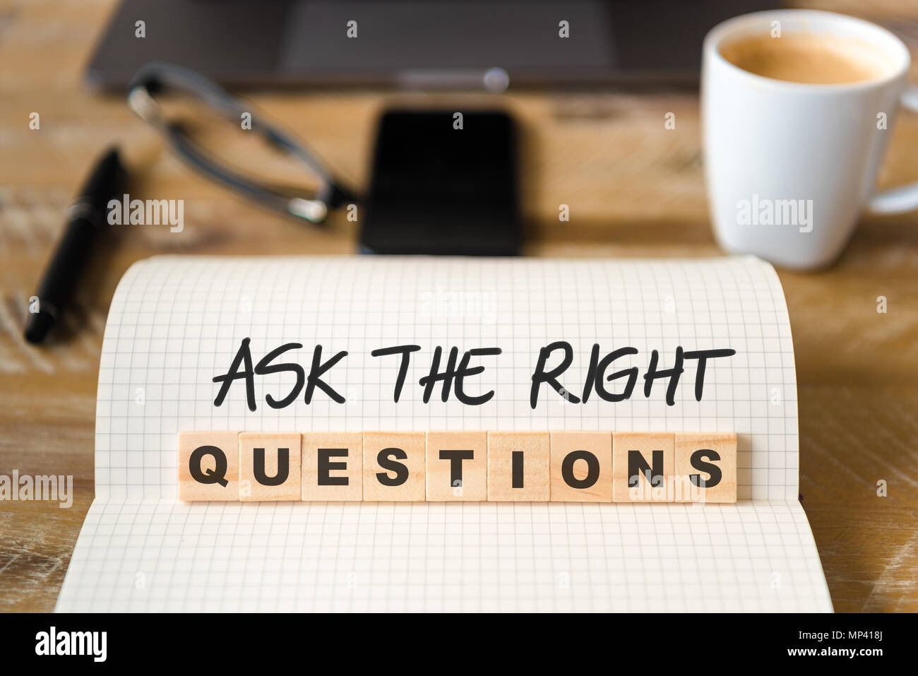 Closeup on notebook over wood table background, focus on wooden blocks ...