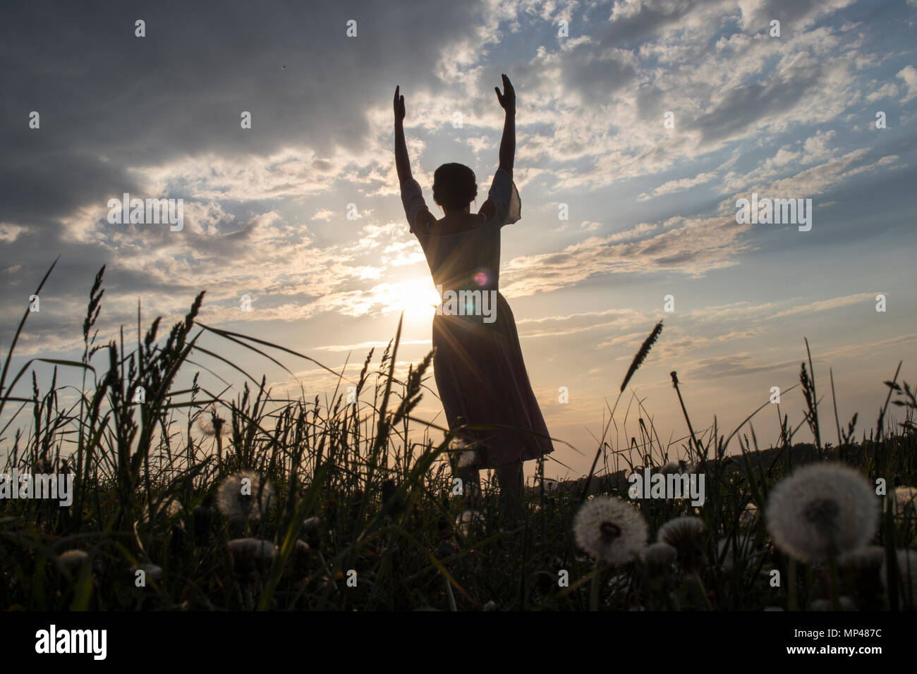 Dance and yoga performance ritual by sunset Stock Photo - Alamy