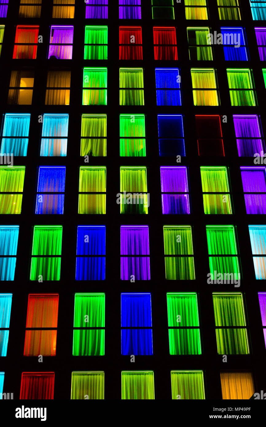 Colored windows texture. Windows illuminated by neon lights background ...