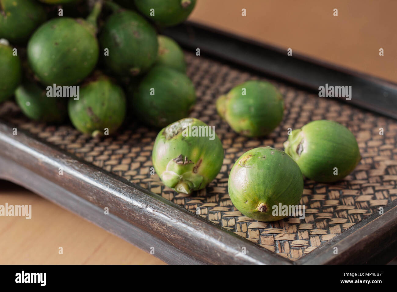 Betel nut on the old wooden tray Stock Photo - Alamy