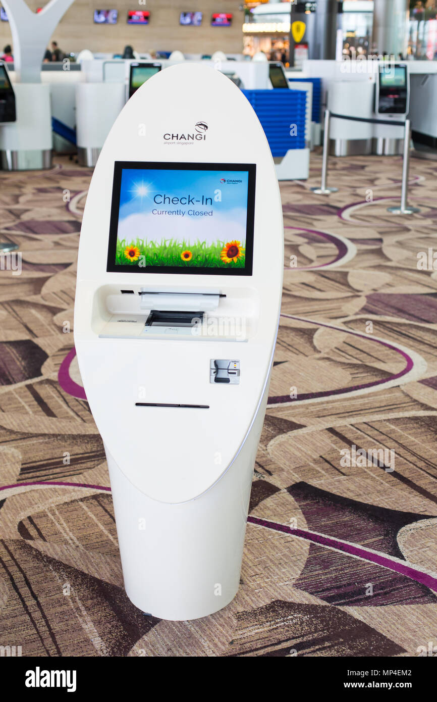 A white colour kiosk machine that process self-service check-in at ...