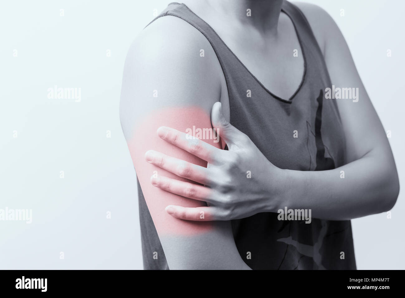 closeup women arm and shoulder pain/injury with red highlights on pain ...