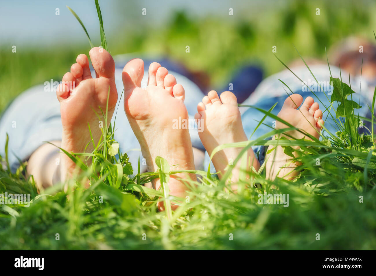 Bare feet on green grass Stock Photo - Alamy