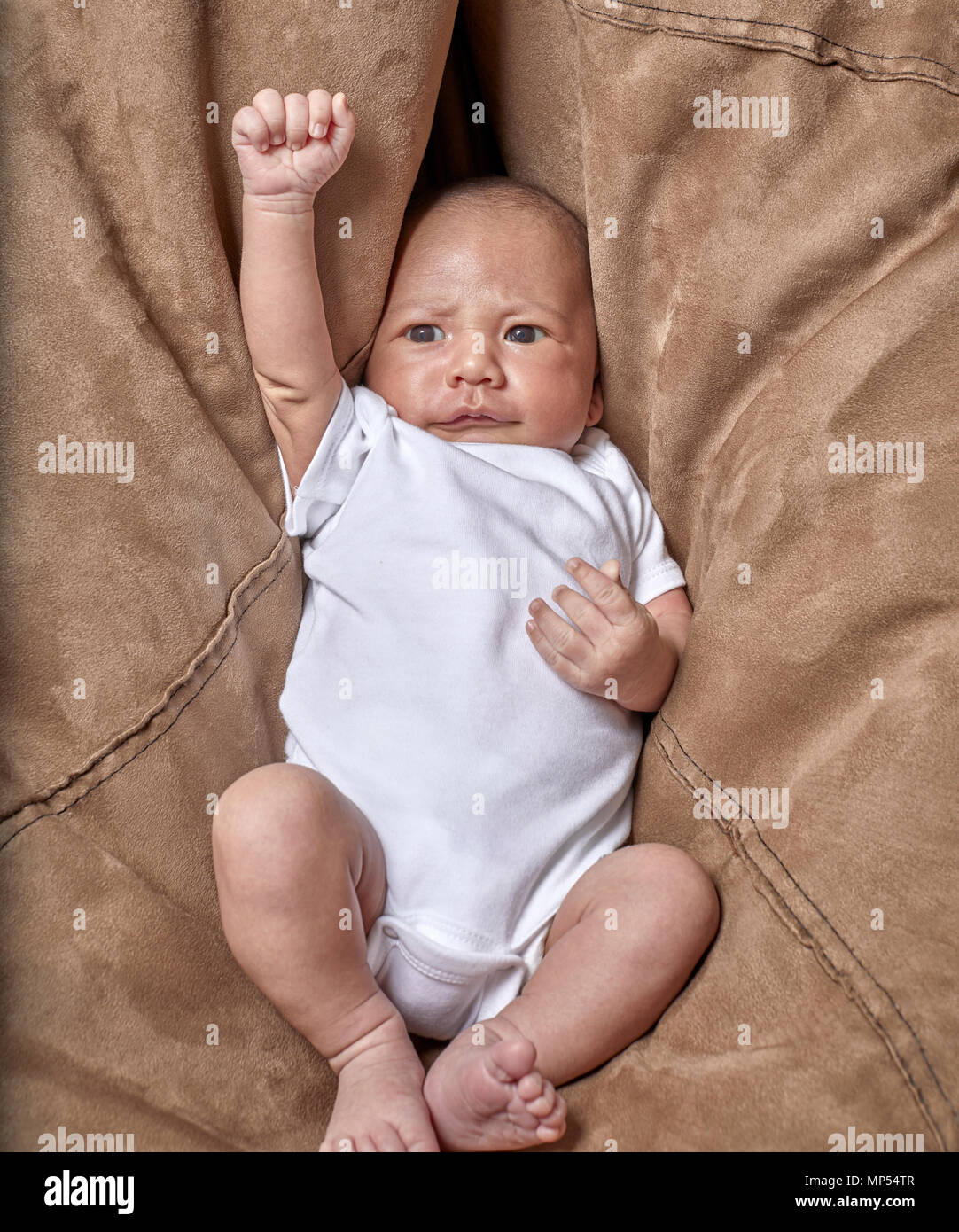 Baby with arm raised hi-res stock photography and images - Alamy