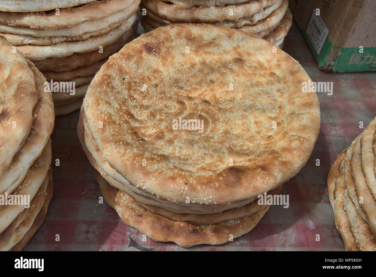 Fresh flatbread at a Muslim bakery in Dunhuang, Gansu, China Stock ...
