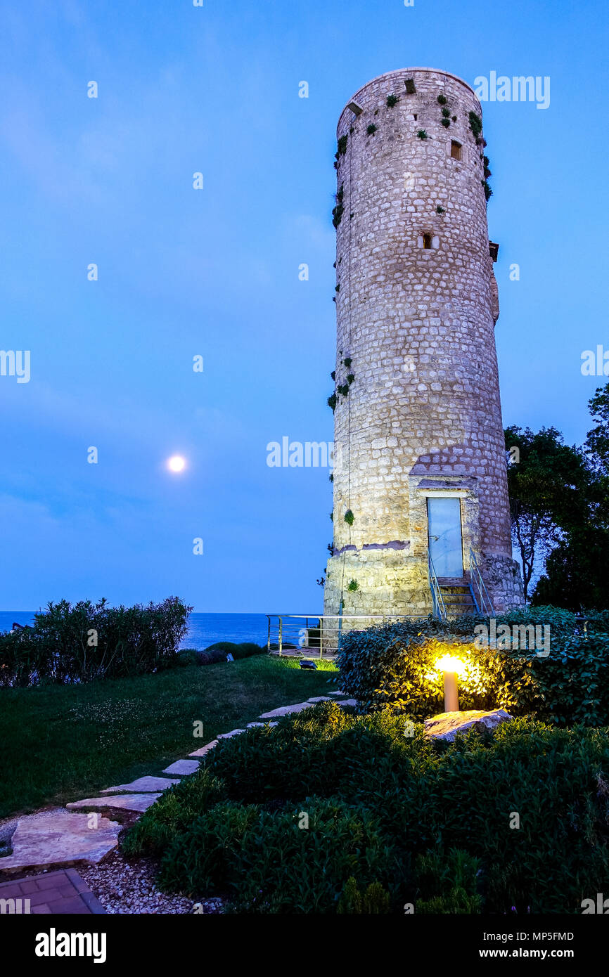 Ancient traditional stone lighthouse in dawn, oldest lighthouse in the ...