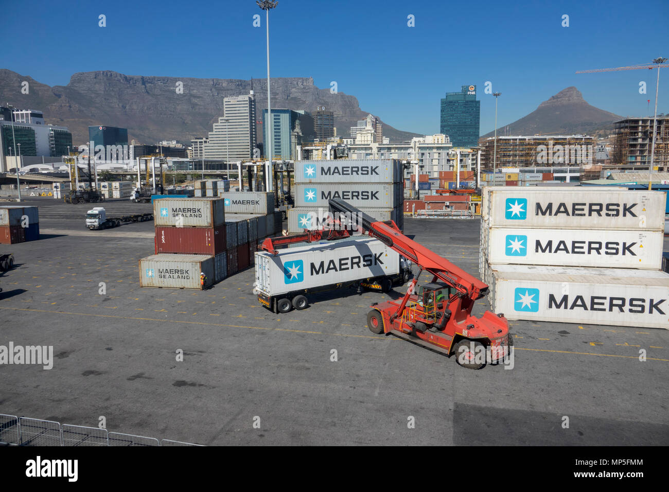 Wharf operations, loading shipping containers at Port of Cape Town ...