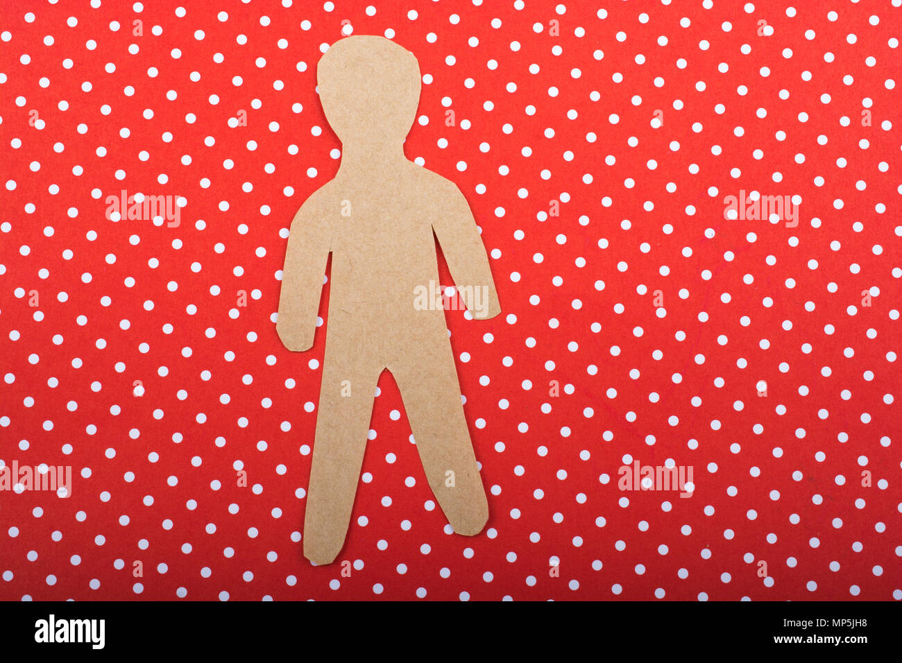 Little man figurine cut out of brown paper Stock Photo - Alamy