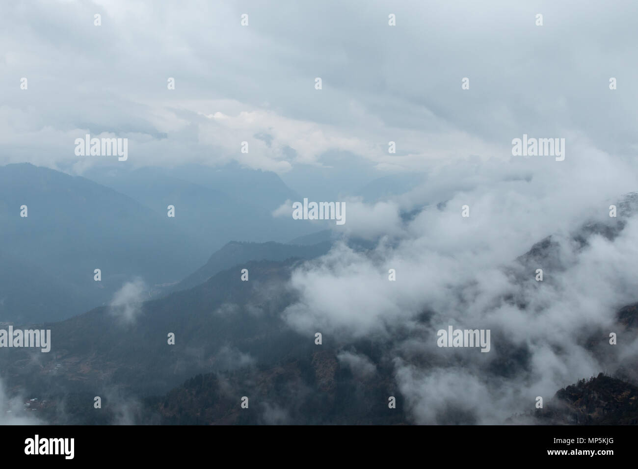 Cloud and snow covered mountain landscape on a hike near Paro, Bhutan ...