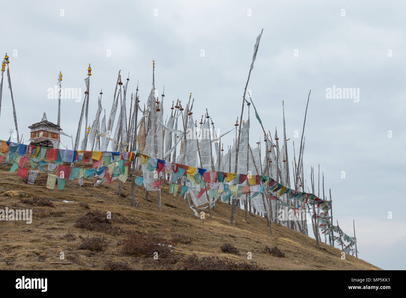 Prayer flags on a remote mountain summit, seen while hiking on the ...