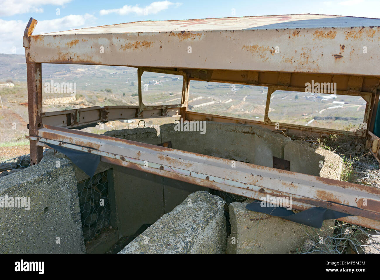 a concrete trench and armored cover at an army guard post in the Golan ...