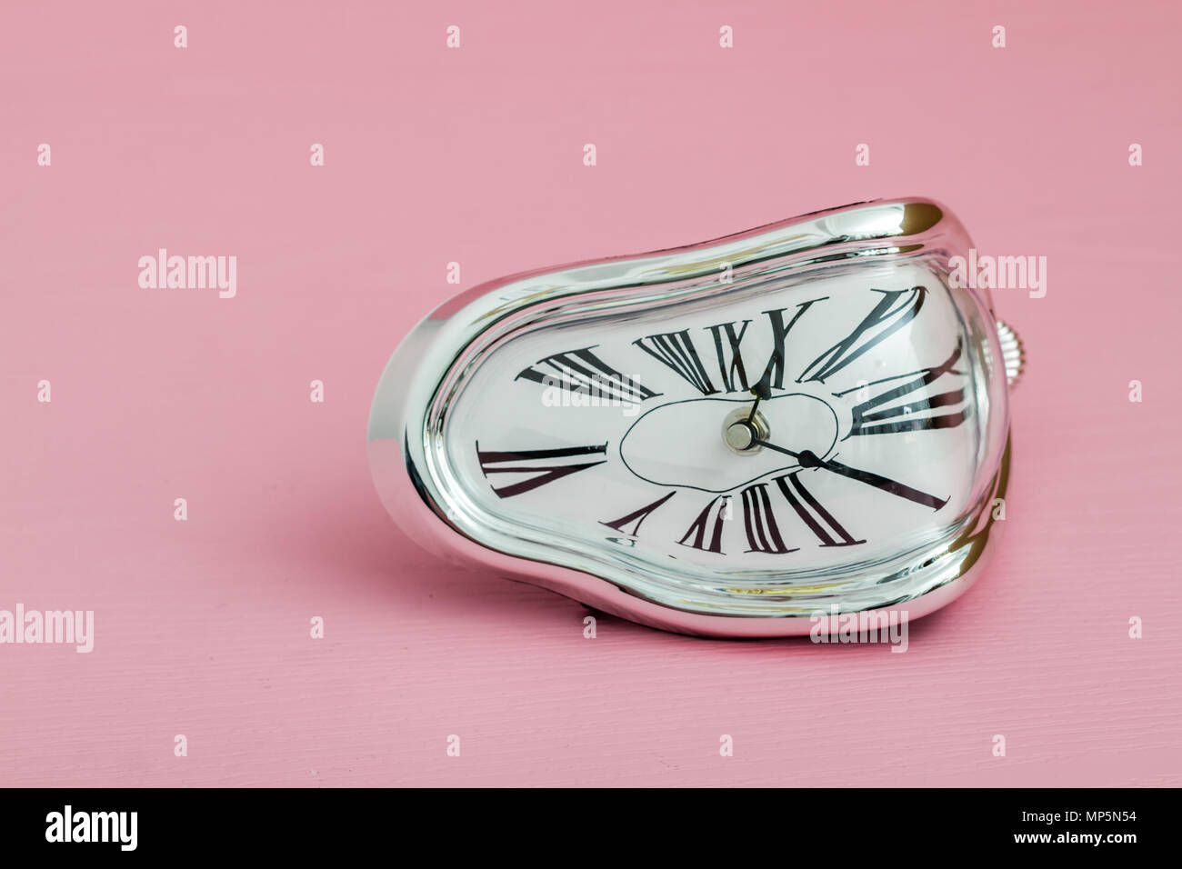 Clock with distorted soft melting design on pink background Stock Photo ...