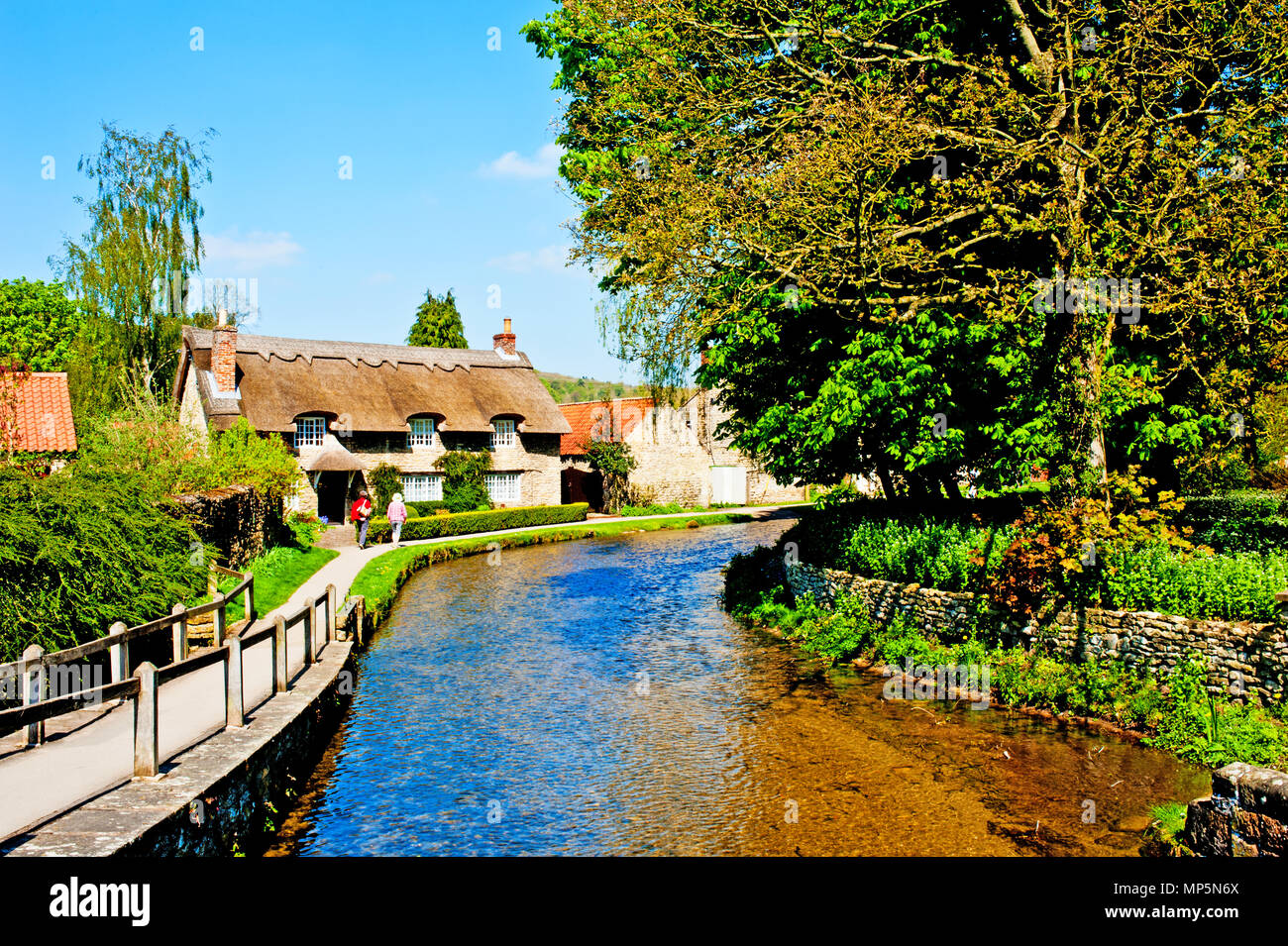Thatched cottage and stream, Thornton Le Dale, North Yorkshire, England ...