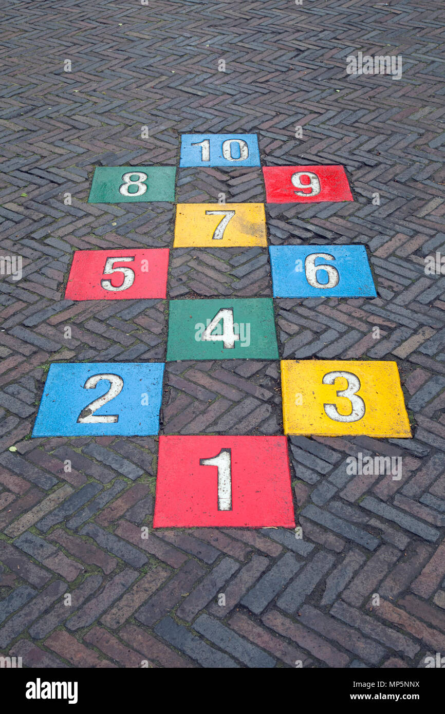 A colourful hopscotch board on a sidewalk Stock Photo - Alamy